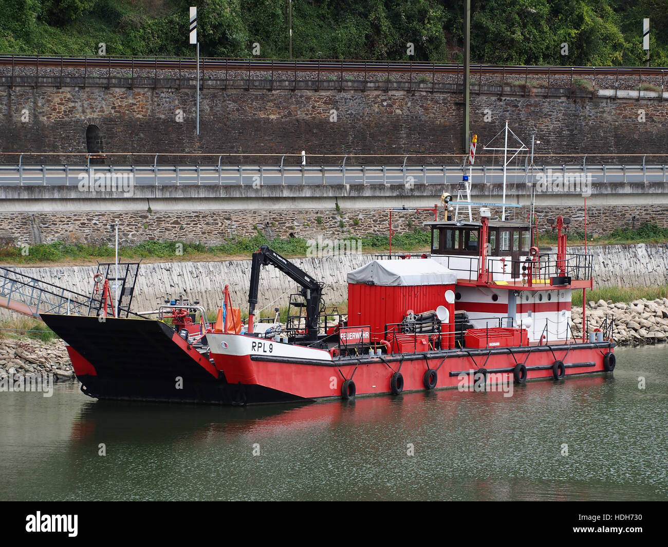 This image depicts a boat navigating the waters of the River Rhine ...