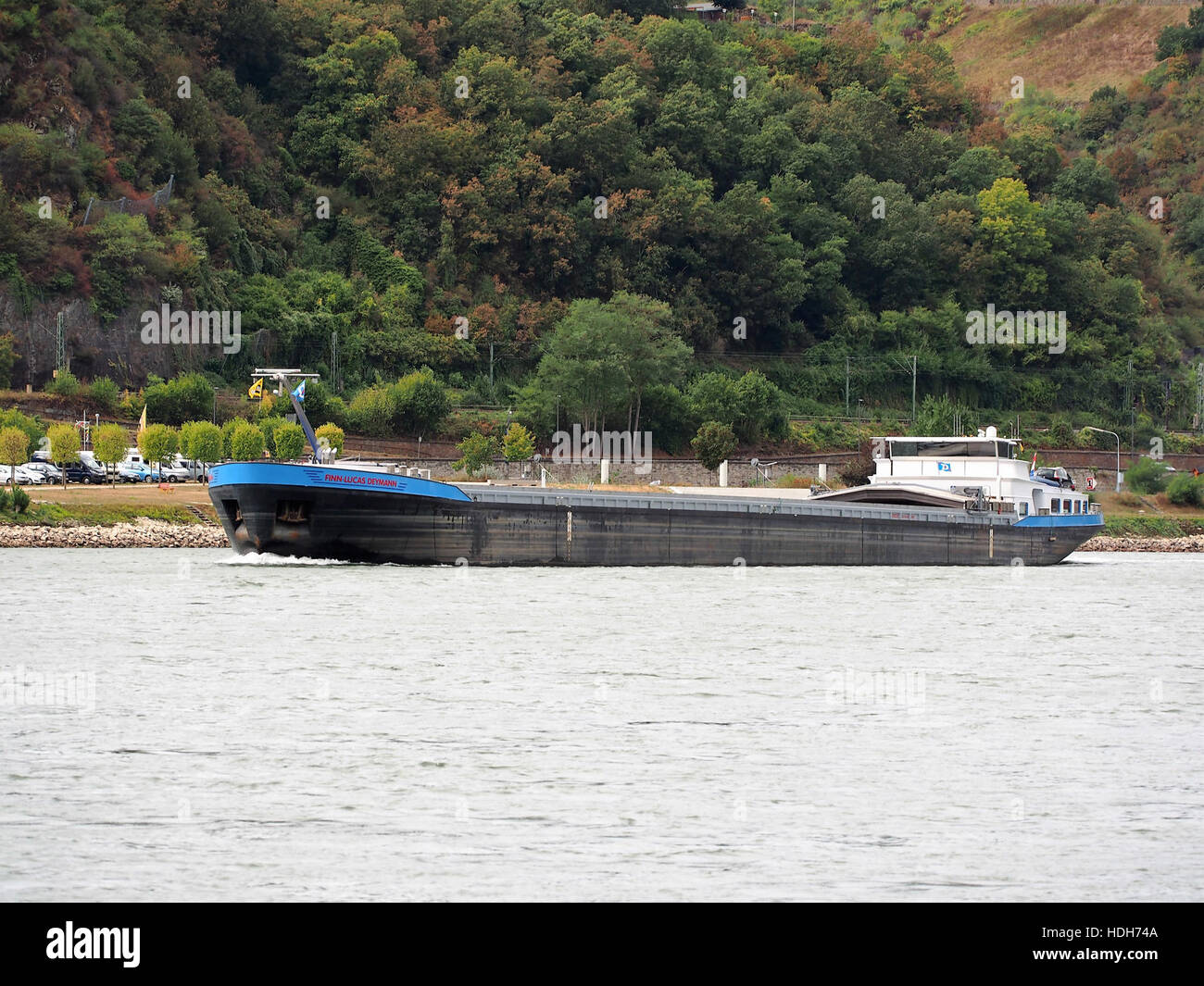 This image depicts a boat on the River Rhine, showcasing the river's ...