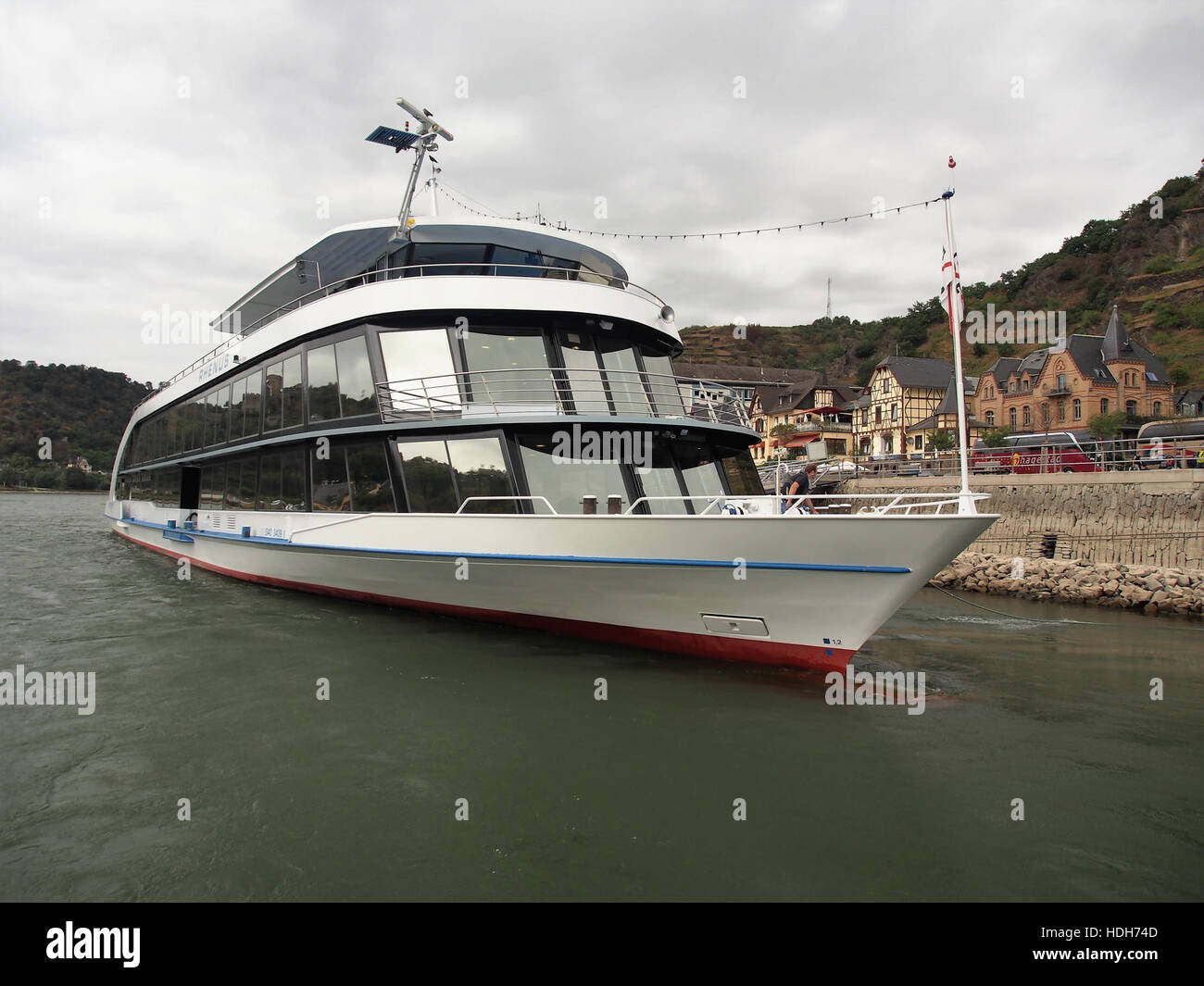 A photograph capturing a boat traveling along the River Rhine. The ...