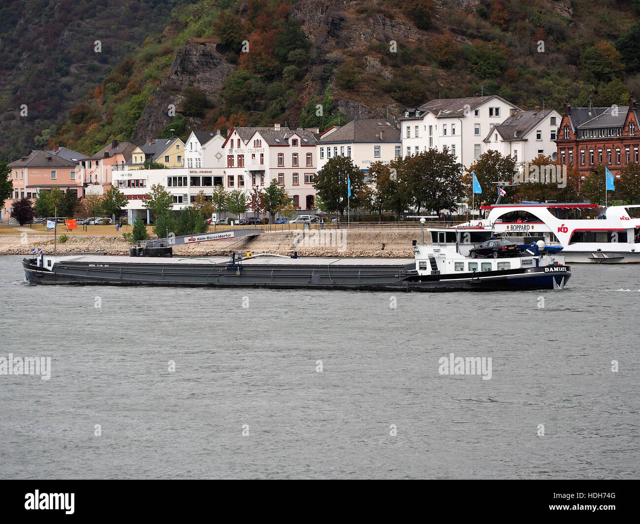 This photograph captures a boat on the River Rhine, with the ship's ...