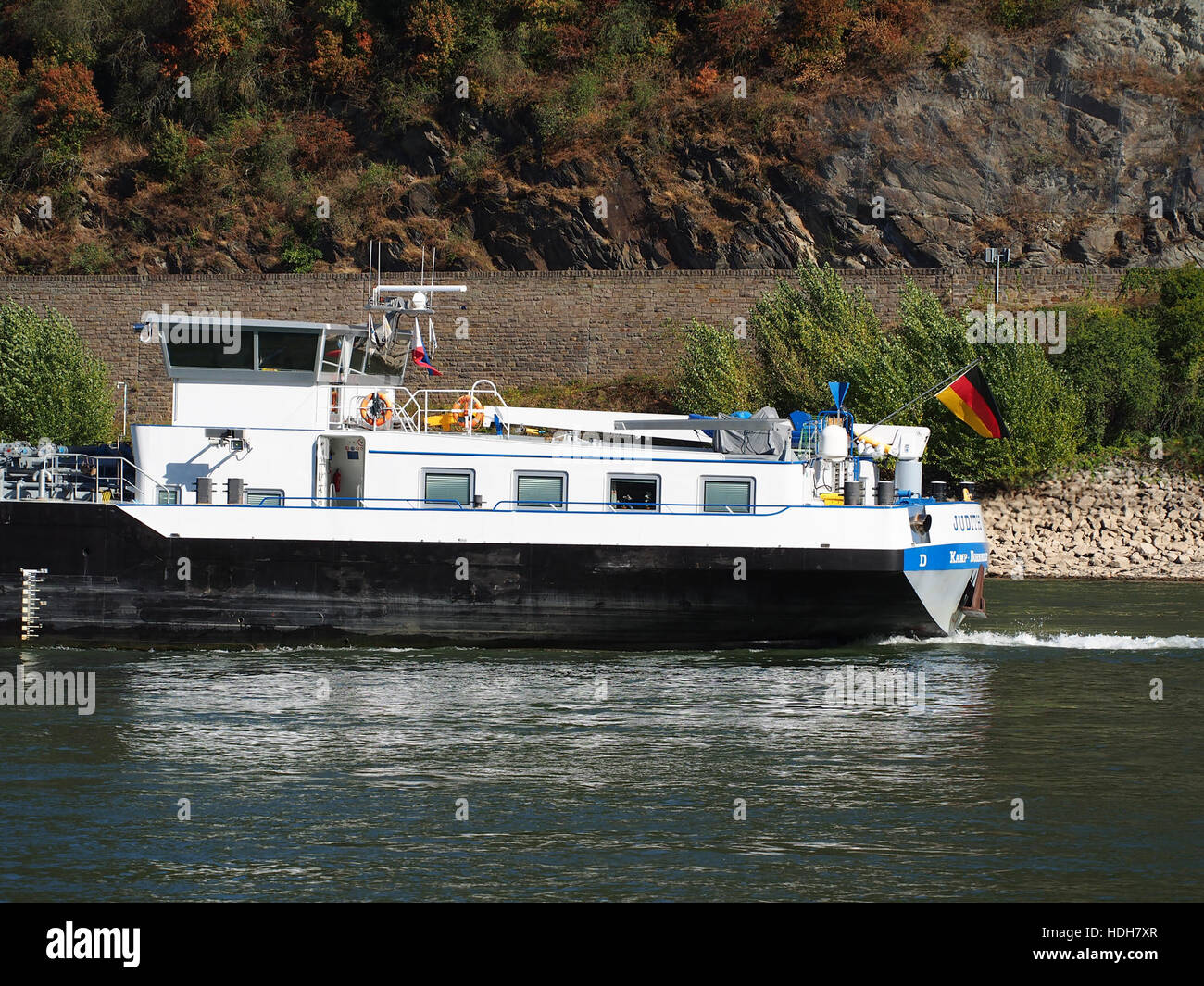 The ship Judith, identified by ENI 04811280, navigates the Rhine River ...