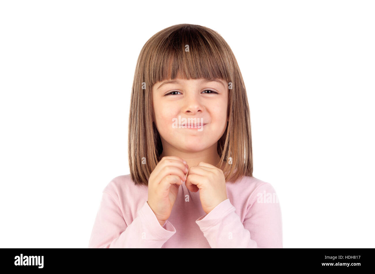 Surprised small girl making gestures isolated on a white background ...