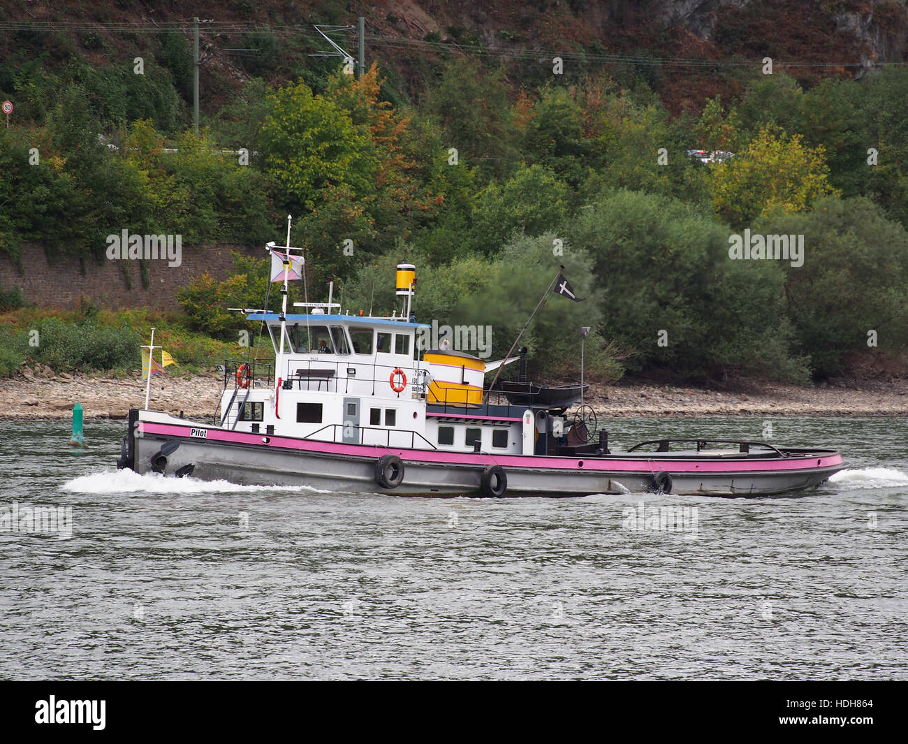 A 1928 ship, identified by ENI number 04302030, is navigating the Rhine ...