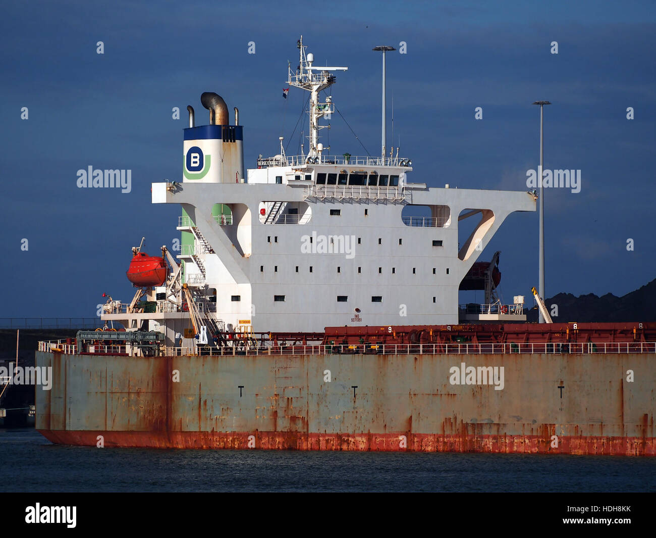This image features the Berge Kinabalu, a large heavy-lift vessel, at ...