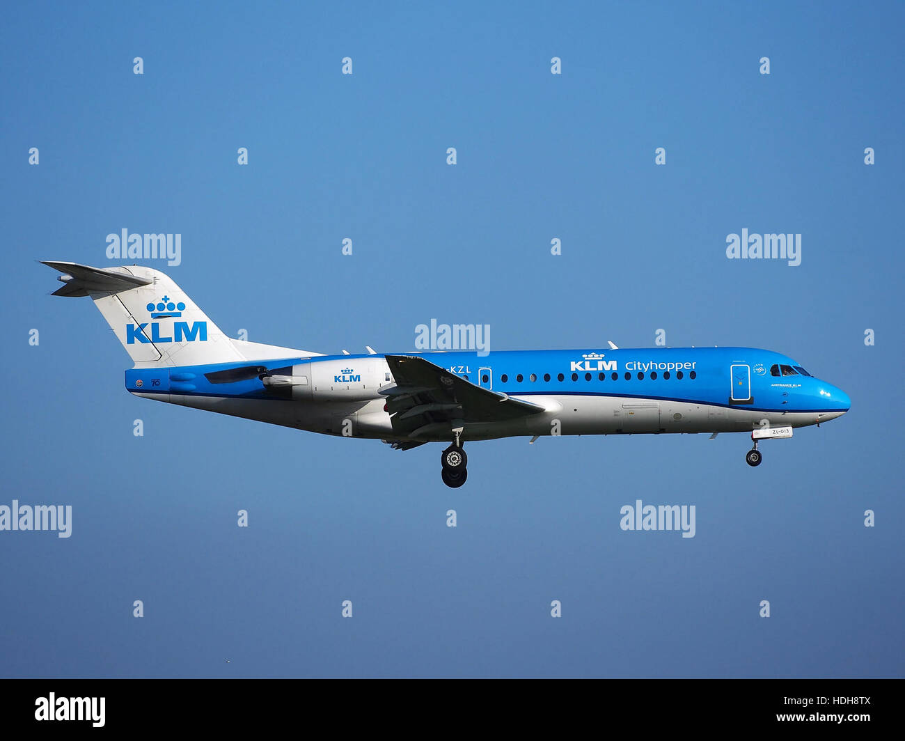 This image shows an aeroplane flying in the sky, with its wings ...