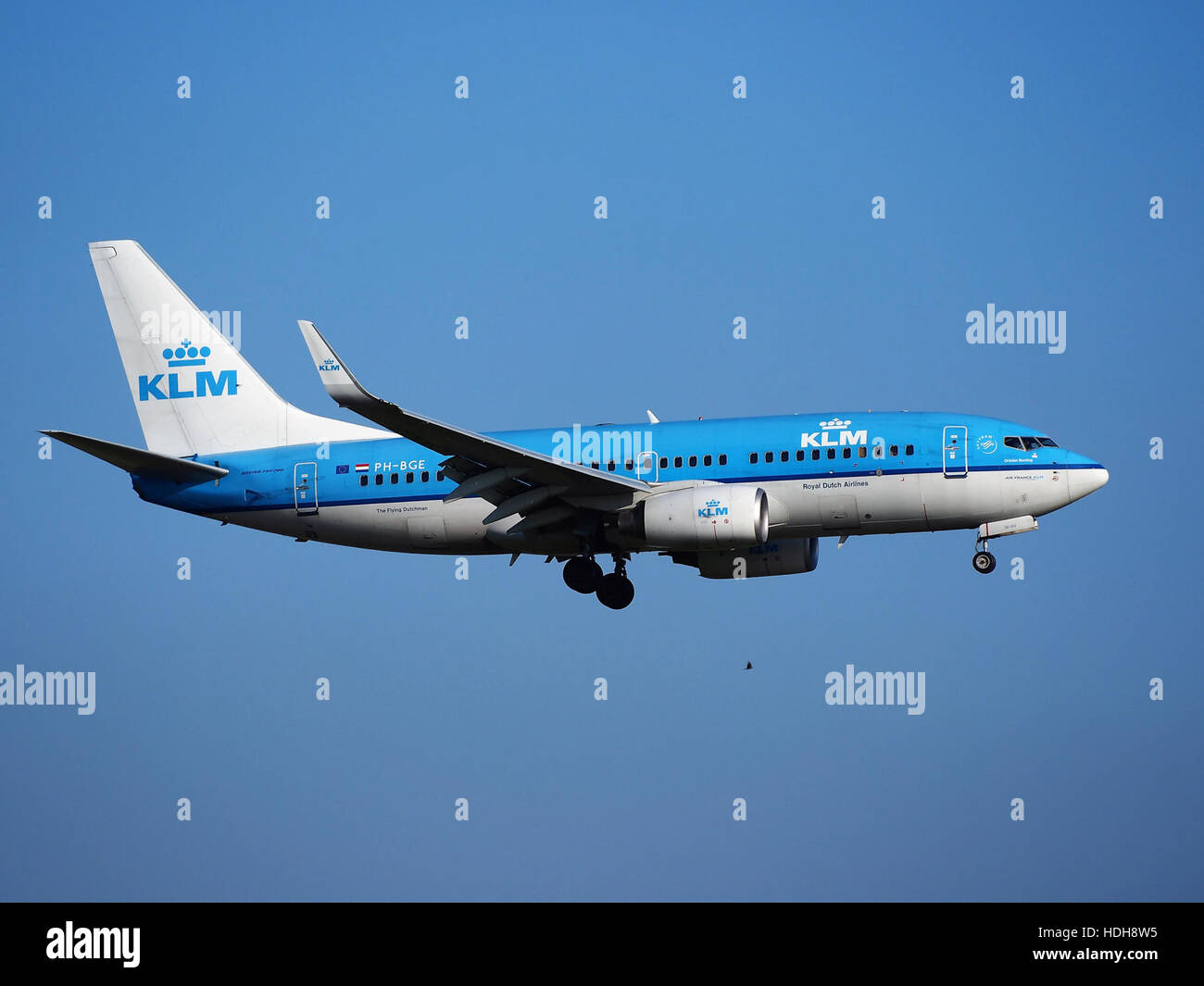 A photograph of an airplane flying in the sky, capturing the moment of ...