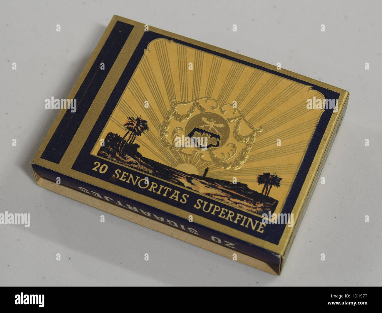 This image shows an old tin container used for storing cigars, biscuits ...