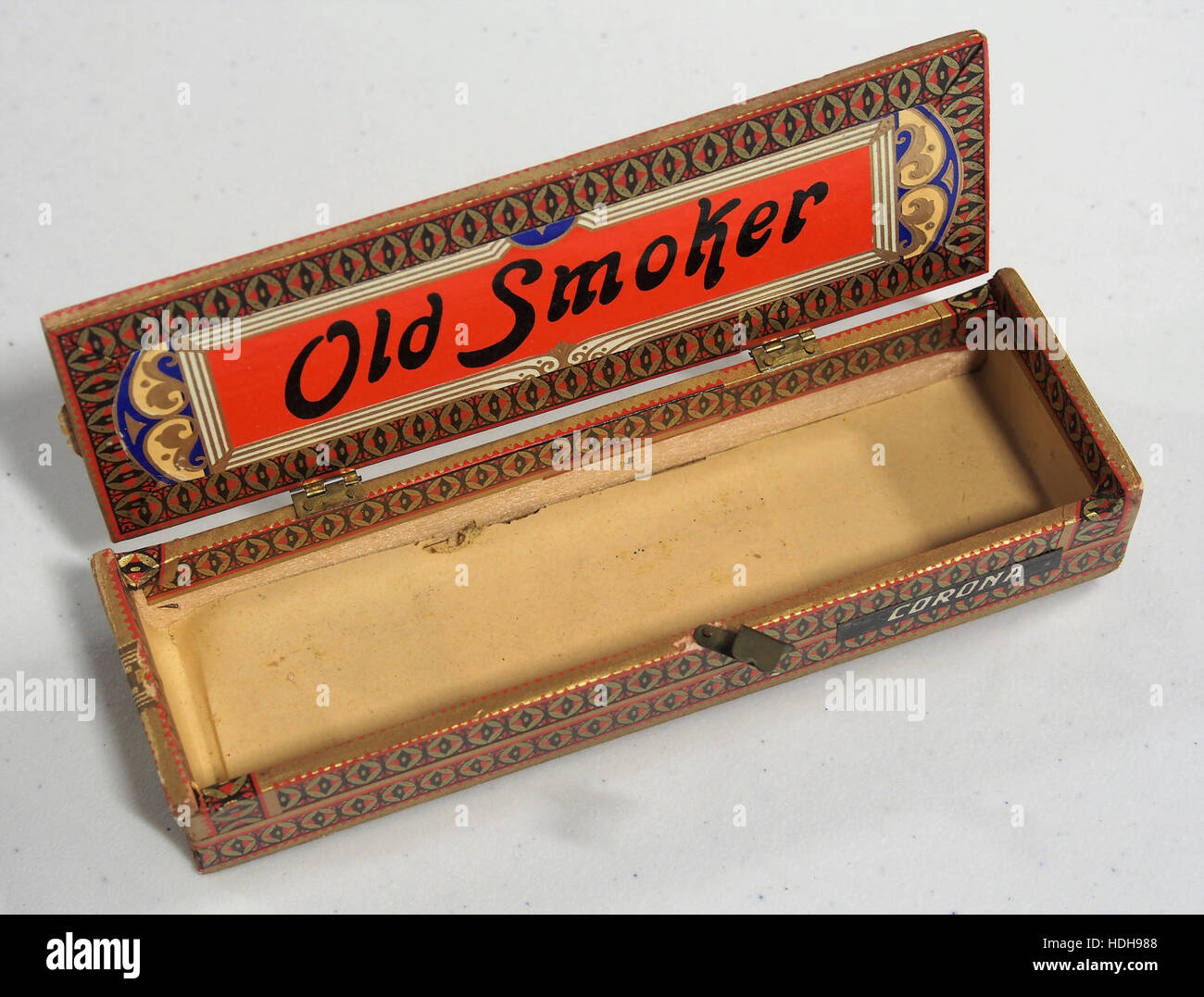 This vintage Old Smoker cigar box, made of tin, was used for storing ...