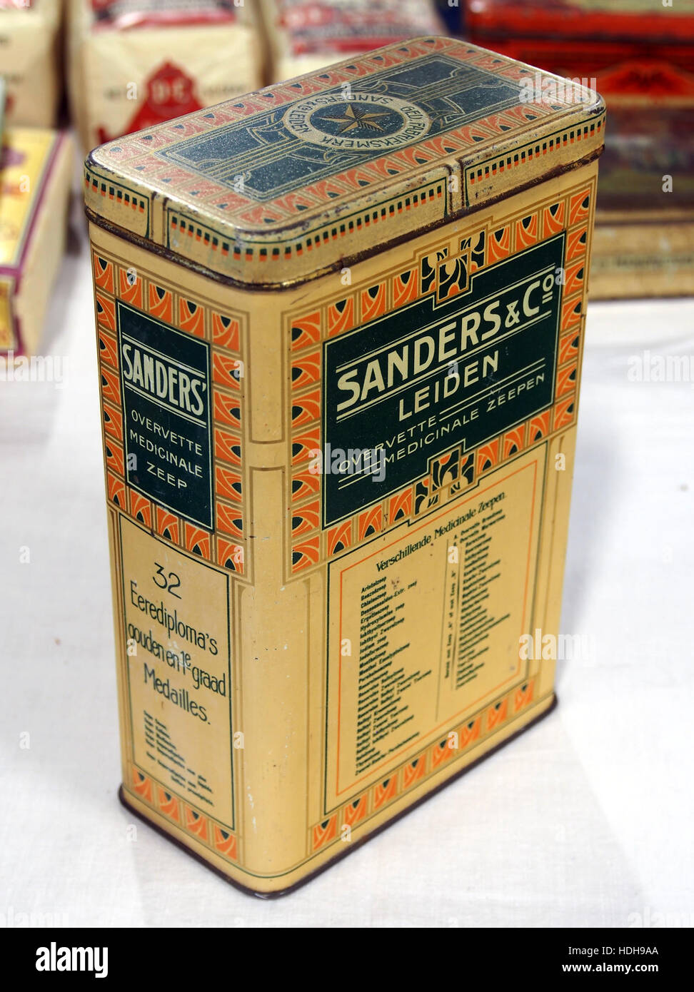 The image features an old tin container from Sanders & Co. in Leiden ...