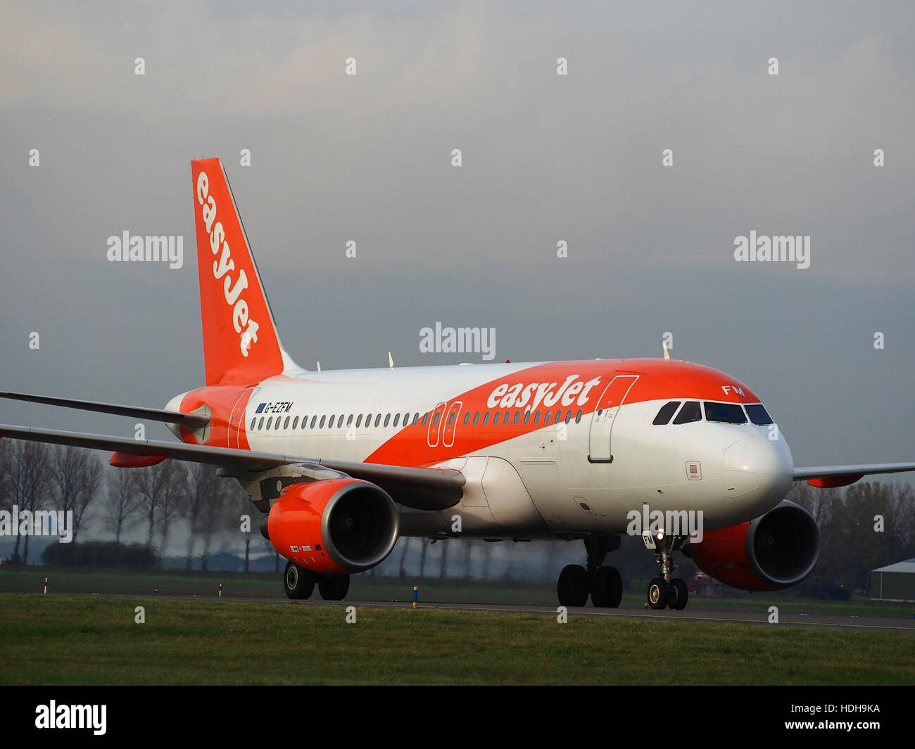 A photograph of aircraft G-EZFM taxiing on runway 18R after landing ...
