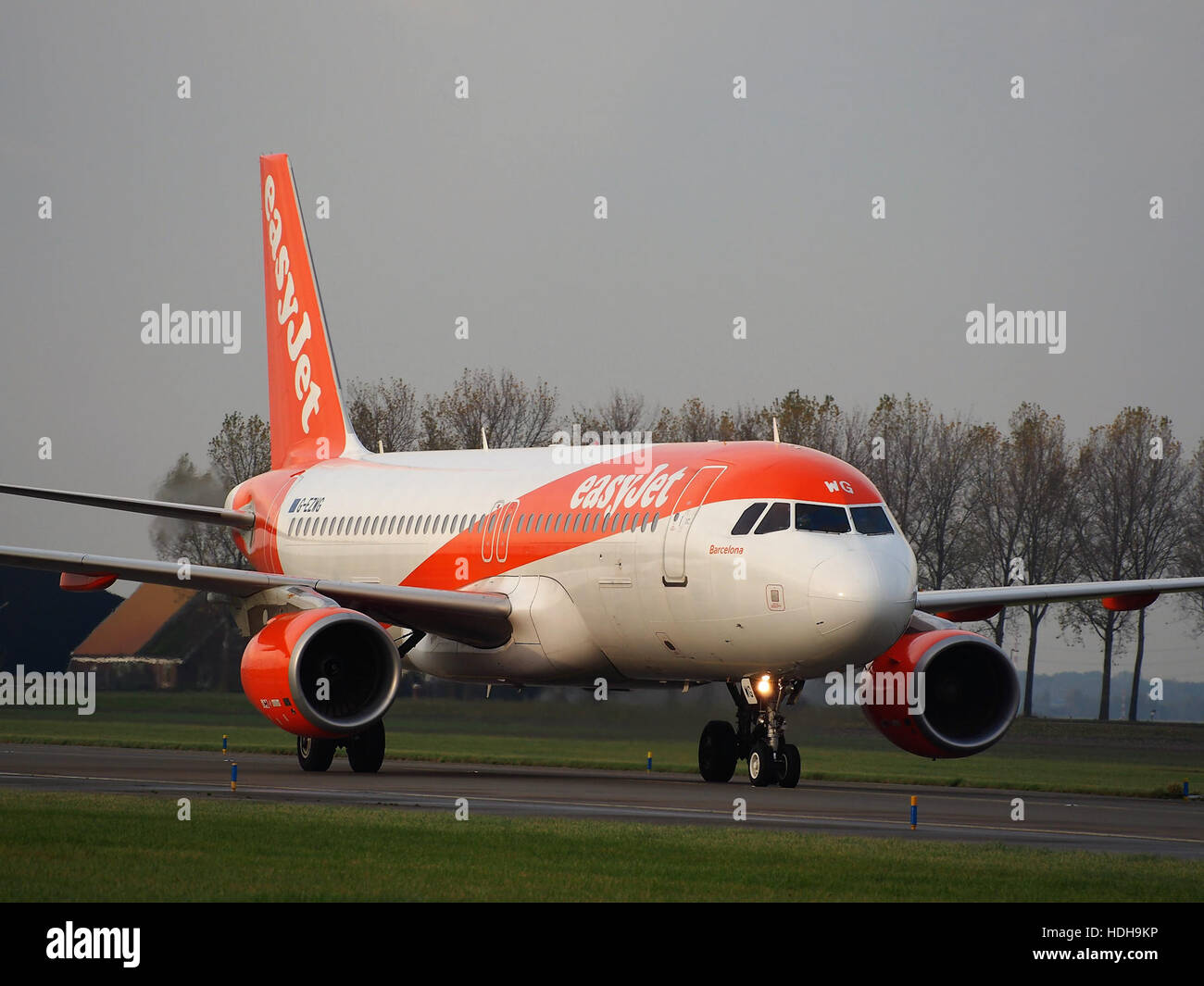 This photograph captures G-EZWG, an aircraft taxiing on runway 18R ...