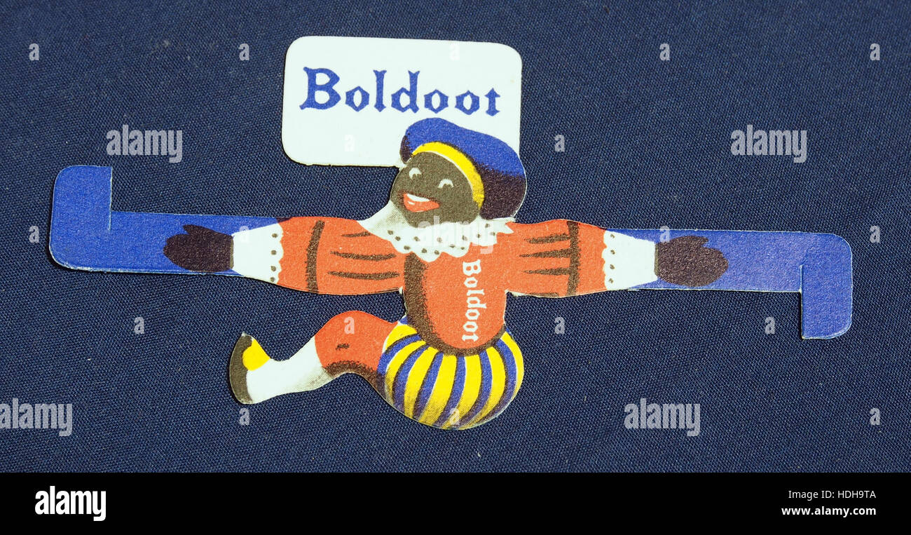This image features a traditional Dutch depiction of *Zwartepiet*, a ...