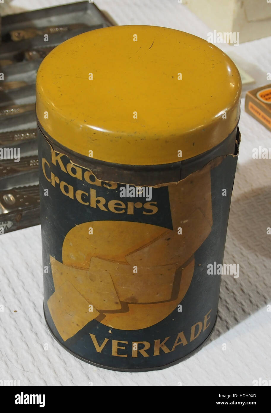 This image features a vintage tin of Verkade Kaas Crackers, a popular ...