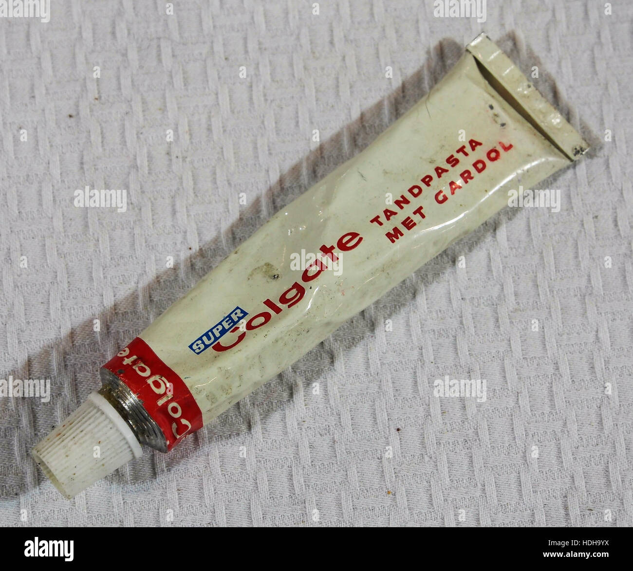 This image shows a classic Colgate toothpaste tube, an iconic item in ...