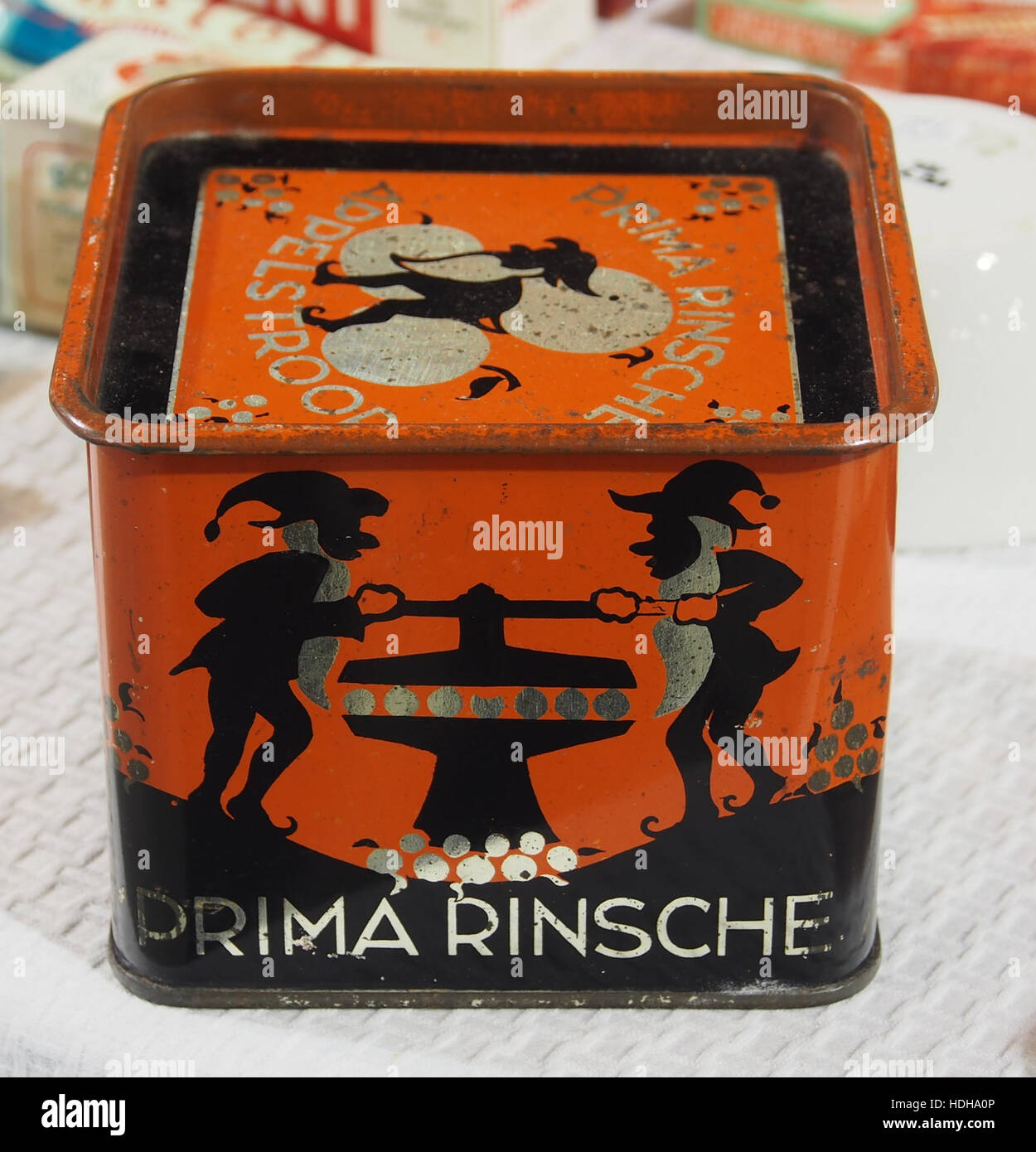 This image shows a vintage square tin of Prima Rinsche Appelstroop, a ...