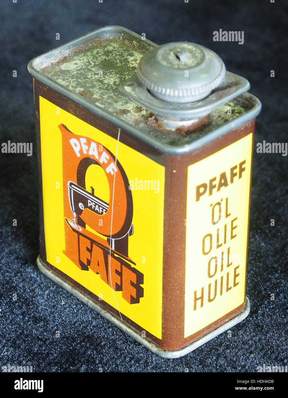 This image showcases a vintage Pfaff sewing machine tin, part of a ...