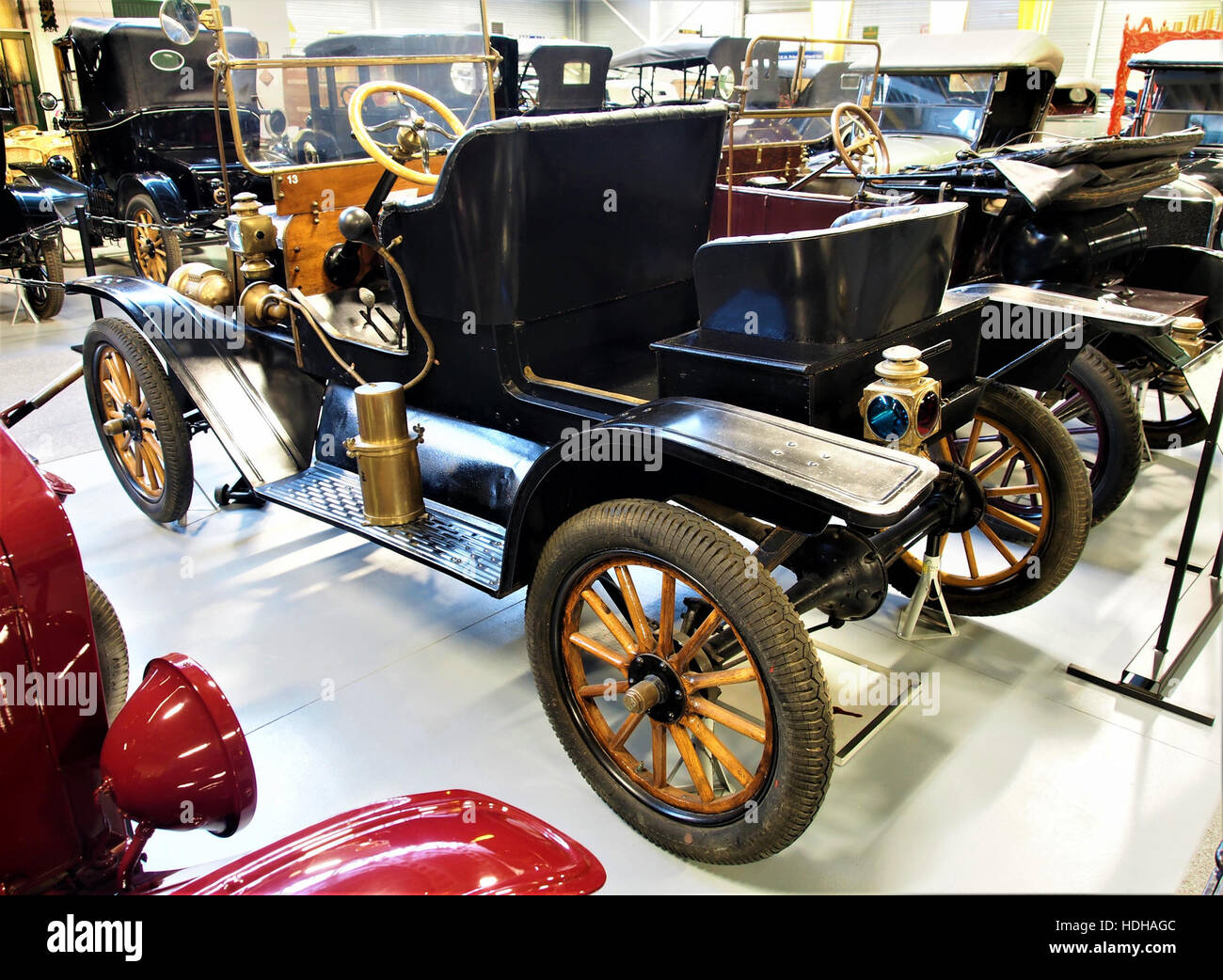 This image showcases a 1909 Ford Model T, featuring a 4-cylinder engine ...