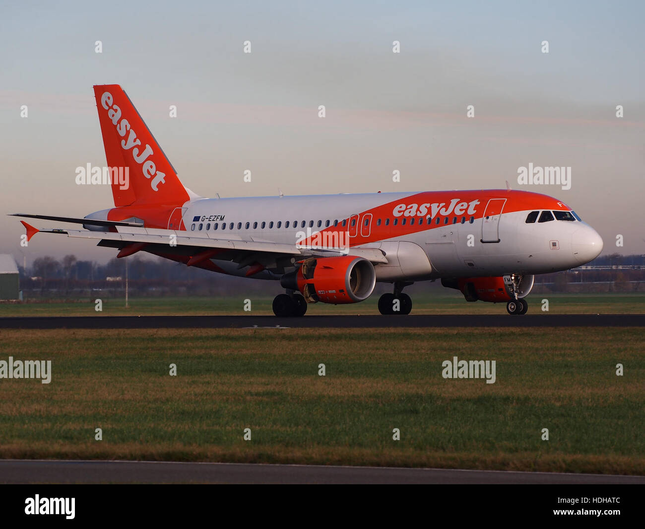 The aircraft G-EZFM taxiing on runway 18R, showcasing post-landing ...