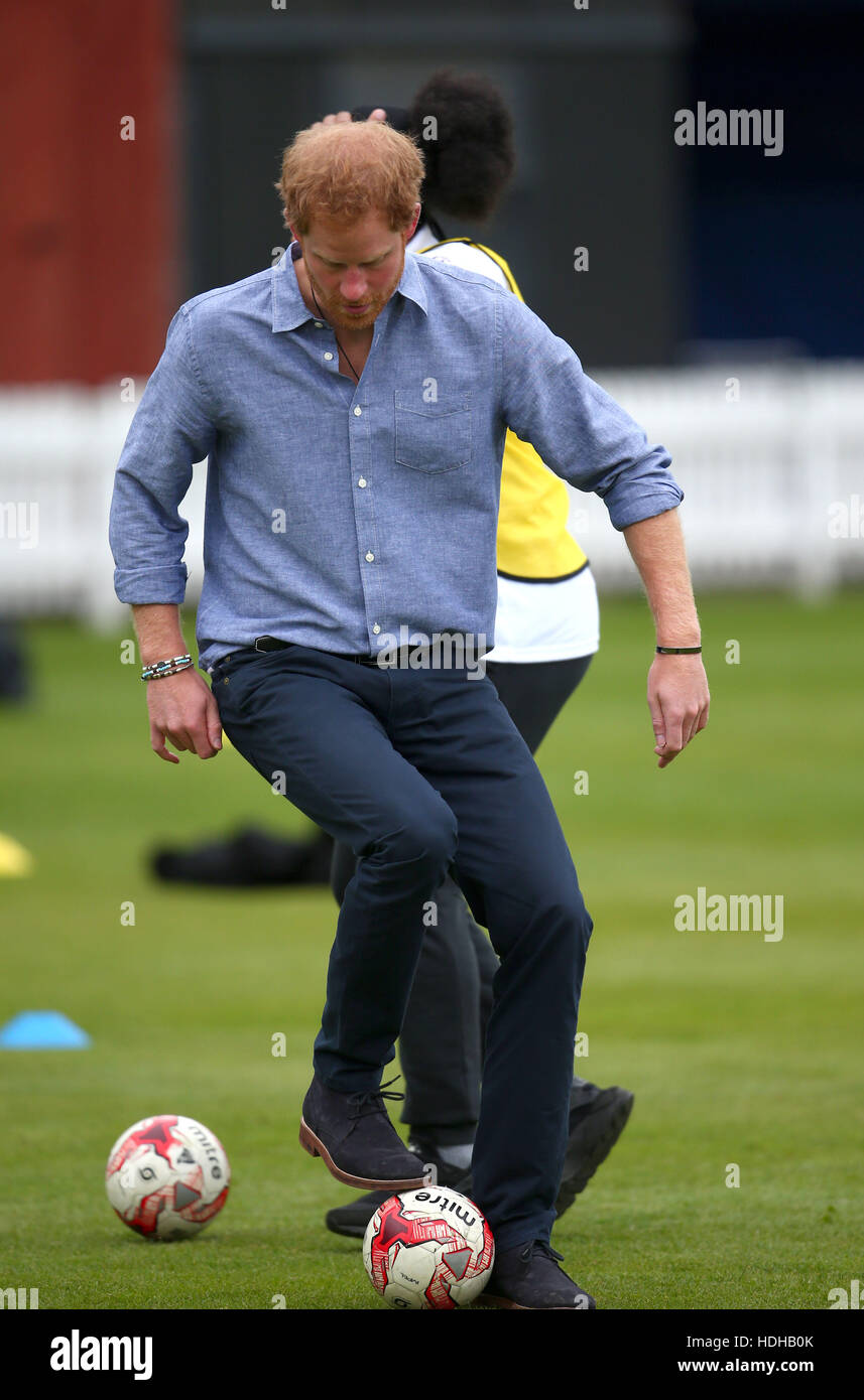 Prince Harry attends a cricket coaching session at Lords Cricket Ground ...