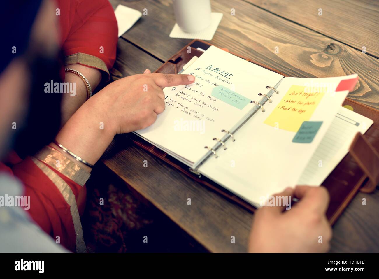 Indian Couple Checking To Do List Concept Stock Photo - Alamy