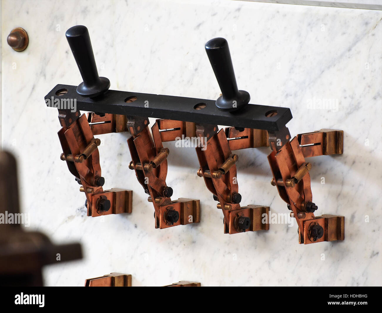 This image depicts old electrical circuit breakers, showcasing ...