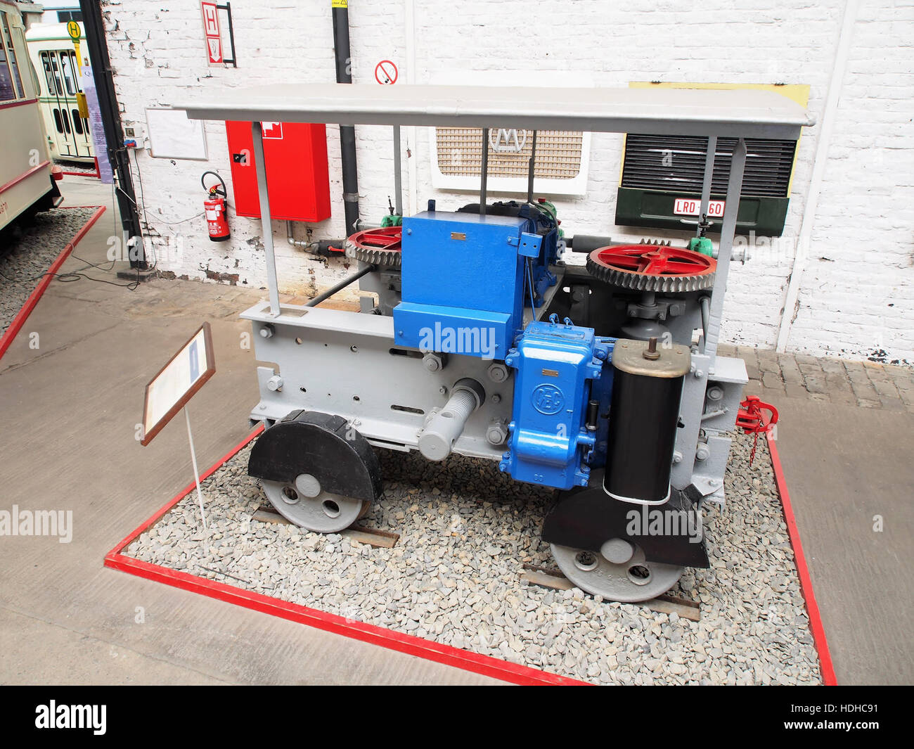This historical photograph showcases a rail track wheelwright, or ...
