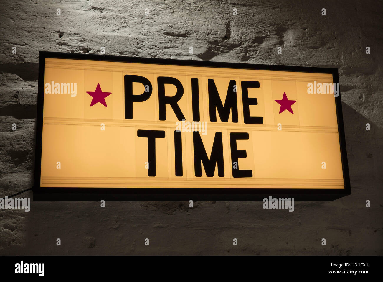 Close-up of Prime Time signboard against gray wall Stock Photo - Alamy