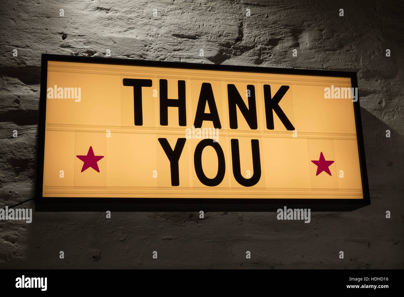 Close-up of Thank You signboard against gray wall Stock Photo - Alamy