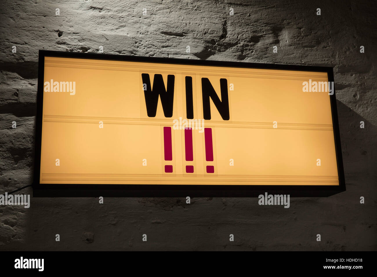 Close-up of Win signboard against gray wall Stock Photo - Alamy