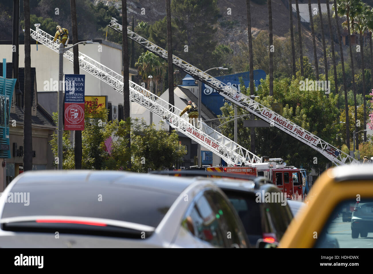 LAFD firefighters respond to an attic fire in an unoccupied building on ...