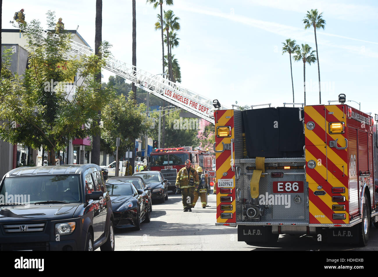 LAFD firefighters respond to an attic fire in an unoccupied building on ...