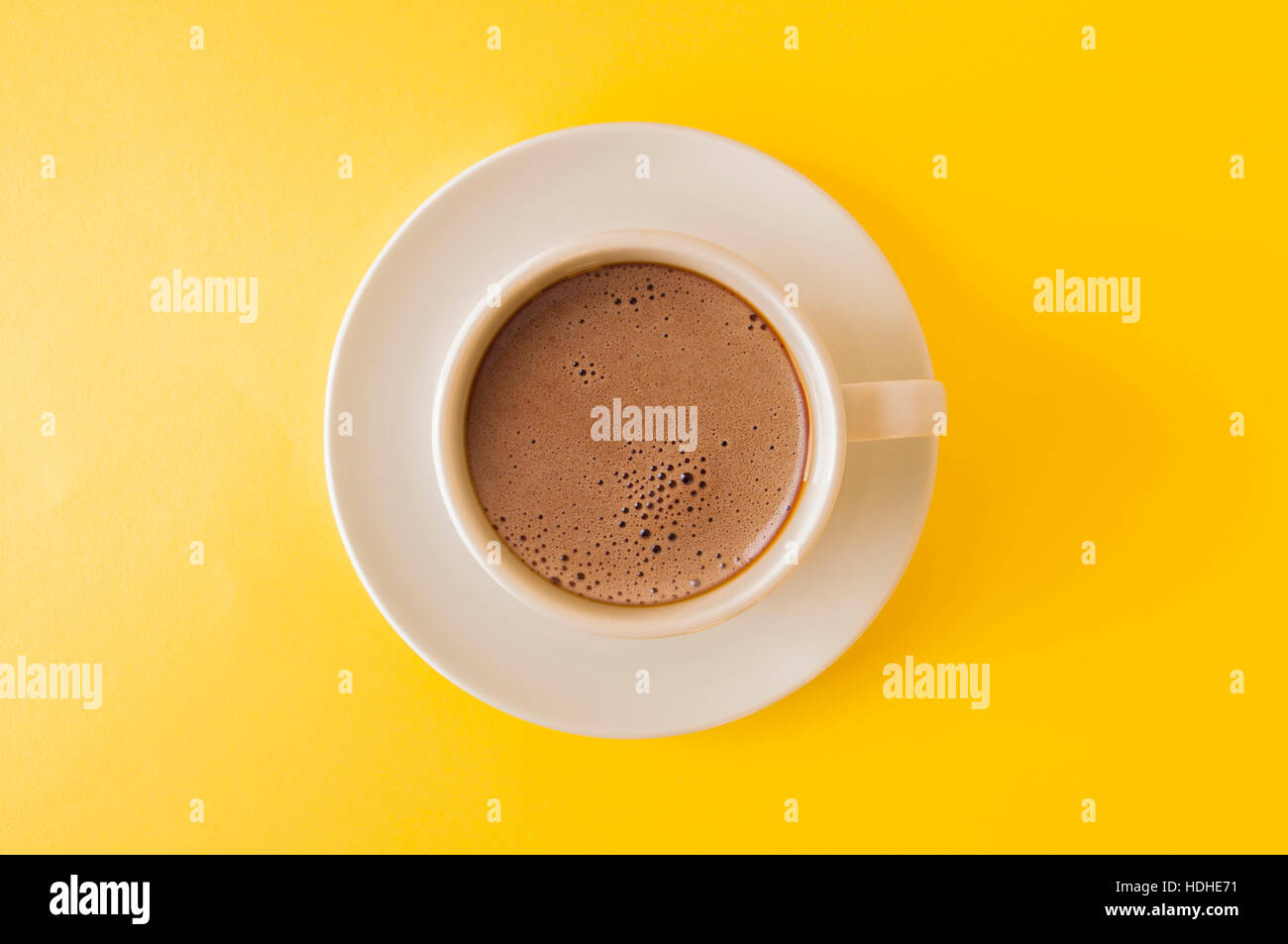 Latte art coffee, yellow color background Stock Photo - Alamy