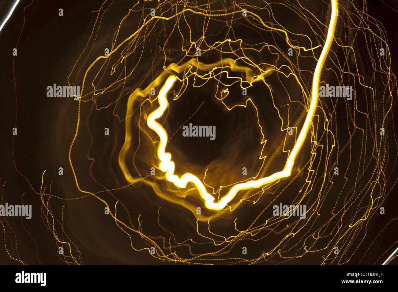 Full frame shot of illuminated light trails over black background Stock ...