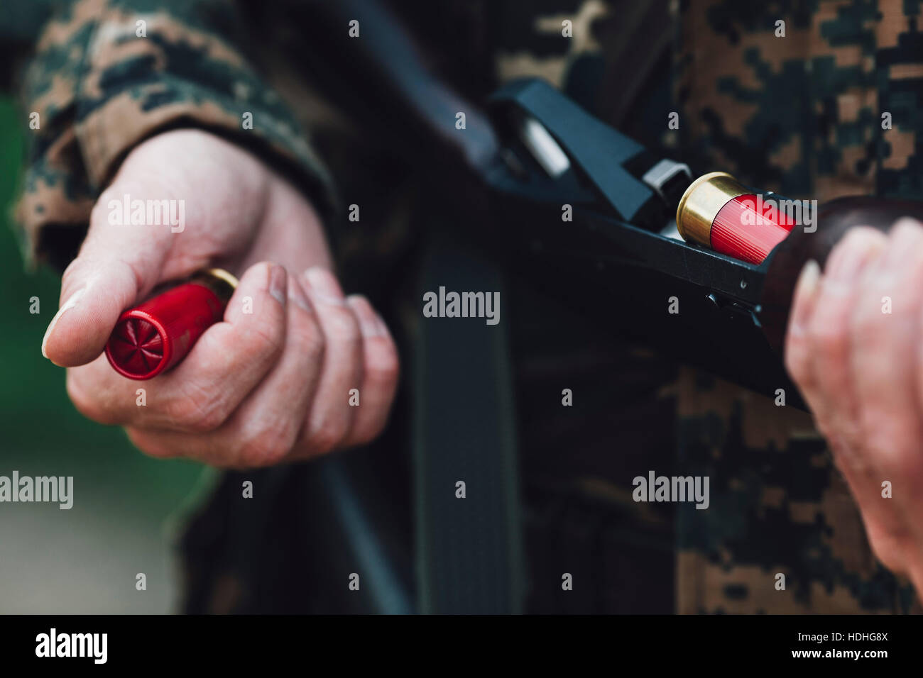 Hand holding rifle hi-res stock photography and images - Alamy