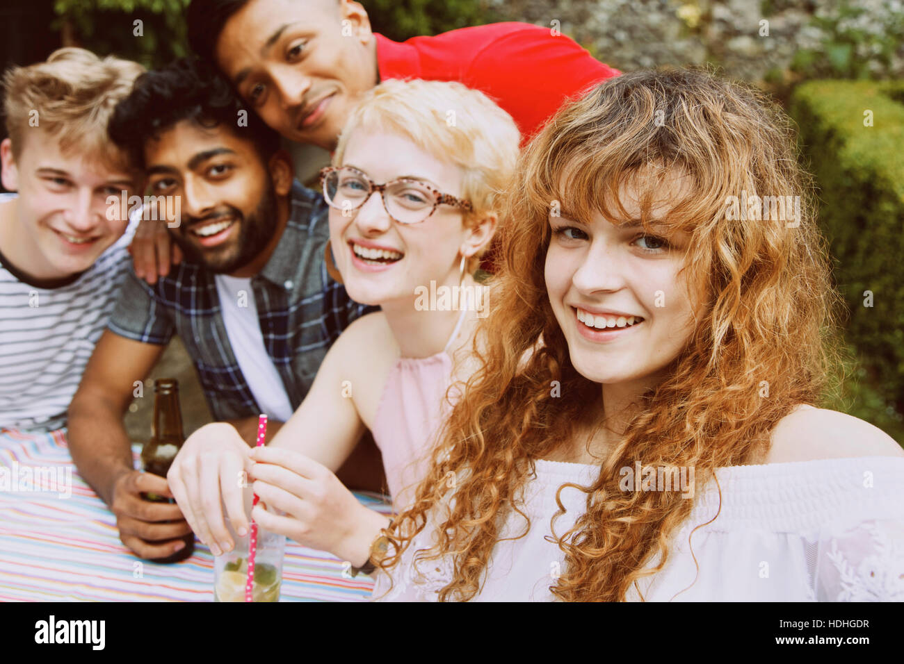 Portrait of happy friends enjoying party at yard Stock Photo - Alamy
