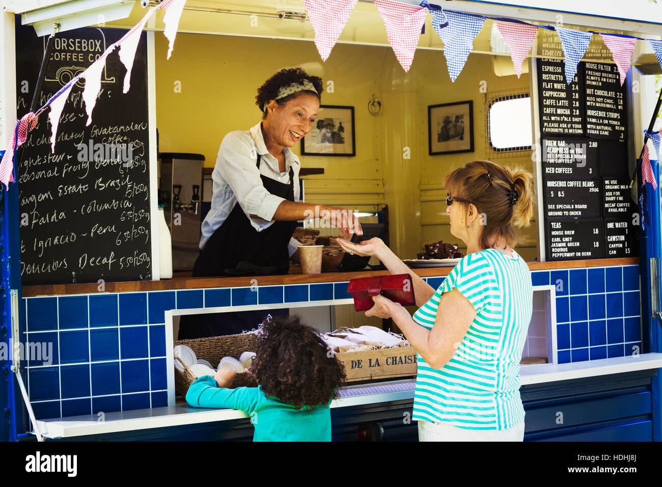 Girl at a shop counter hi-res stock photography and images - Alamy