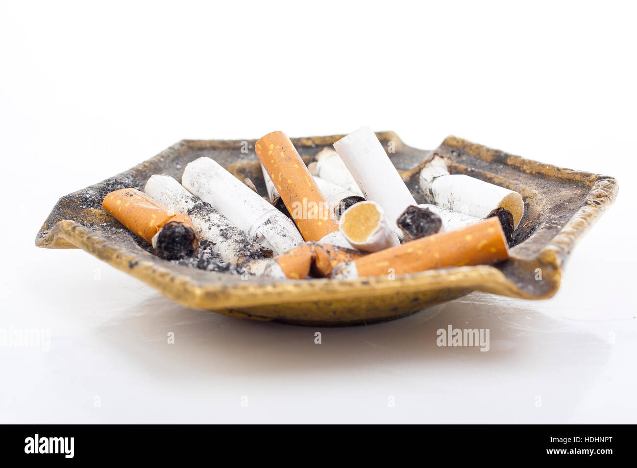Full ashtray can illustrate your work. Copper cigarette ashtray. Dirty ...