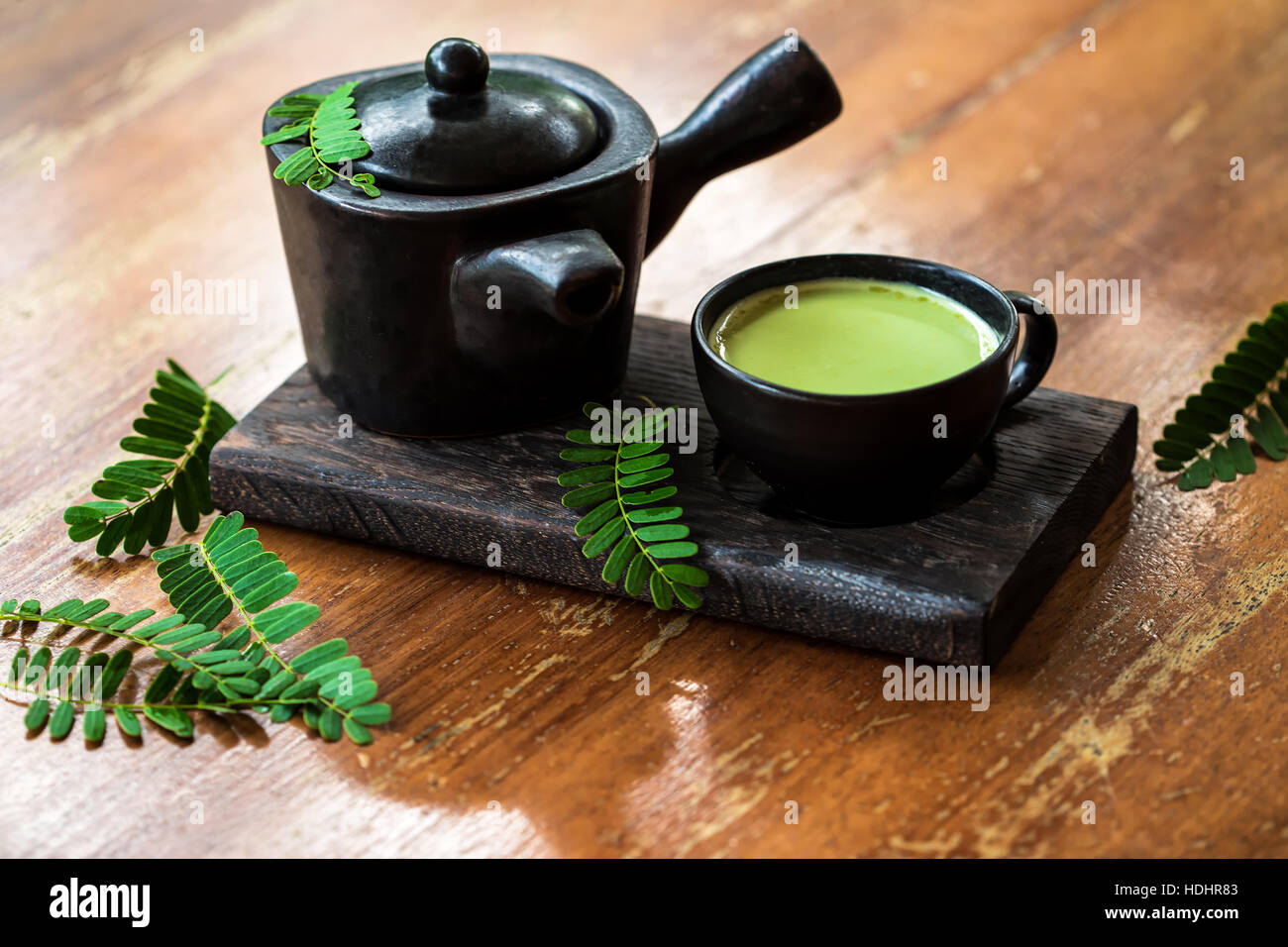 green powder heap isolated on white background Stock Photo - Alamy