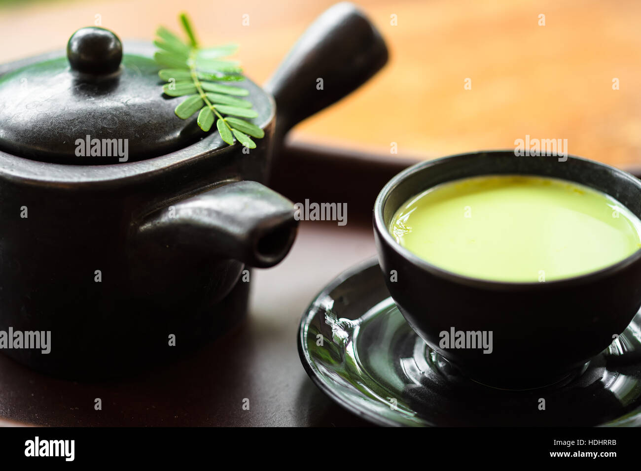 green powder heap isolated on white background Stock Photo - Alamy