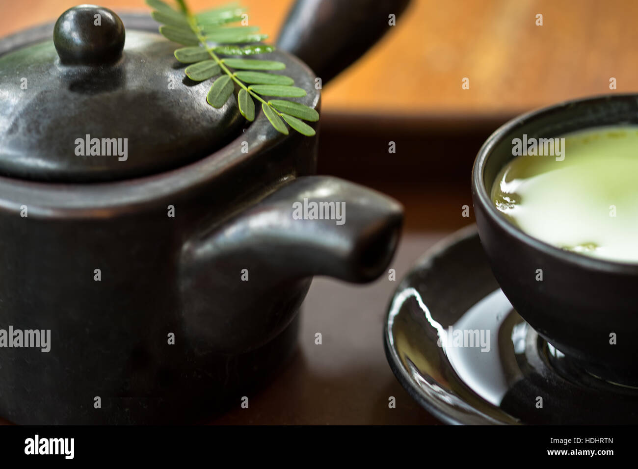 green powder heap isolated on white background Stock Photo - Alamy