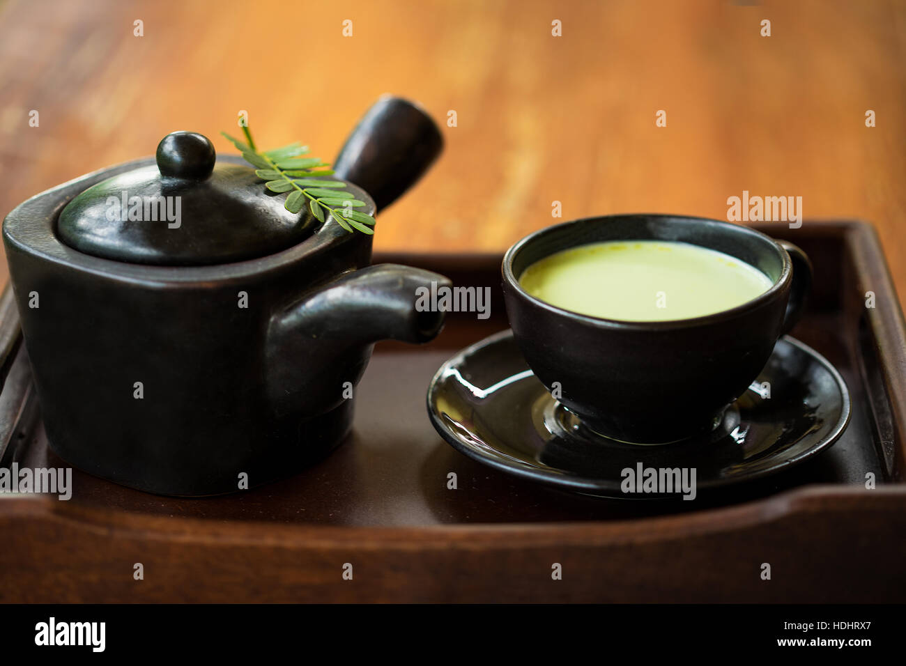 green powder heap isolated on white background Stock Photo - Alamy