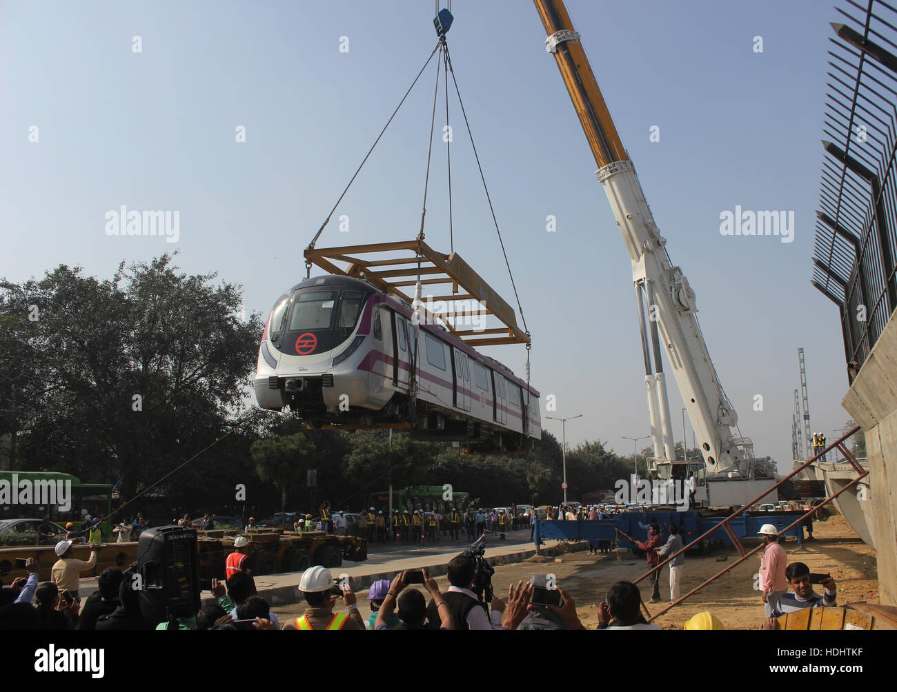 New Delhi, India. 12th Dec, 2016. Unloading of new metro train on track ...