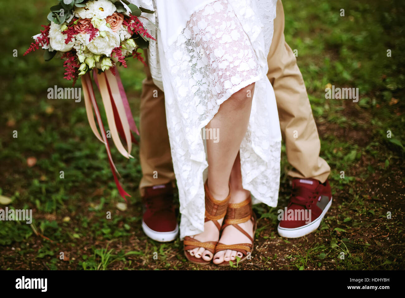 Boho chic style. Legs of wedding couple close-up, freedom concept Stock ...