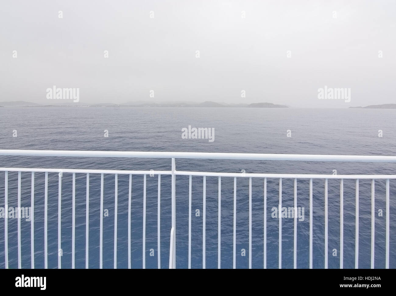 White railing and islands in gray humid weather in October, Ibiza ...
