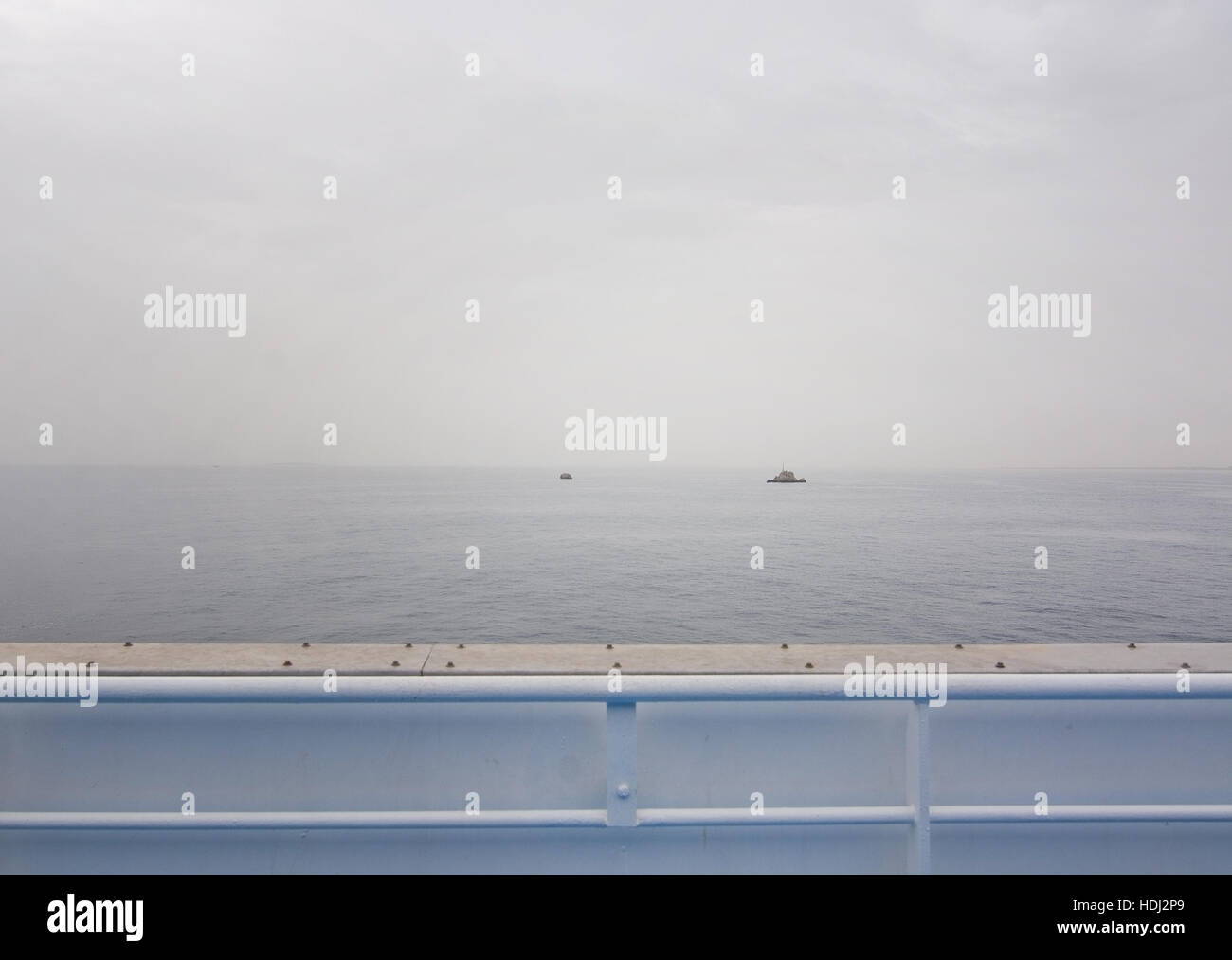 Ferry crossing ocean horizon view on an overcast day at sea in Ibiza ...