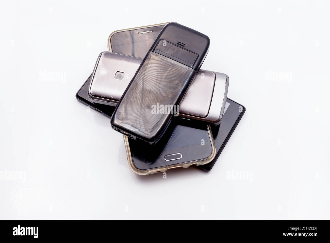 Stack of old used mobile phones isolated on white background Stock ...
