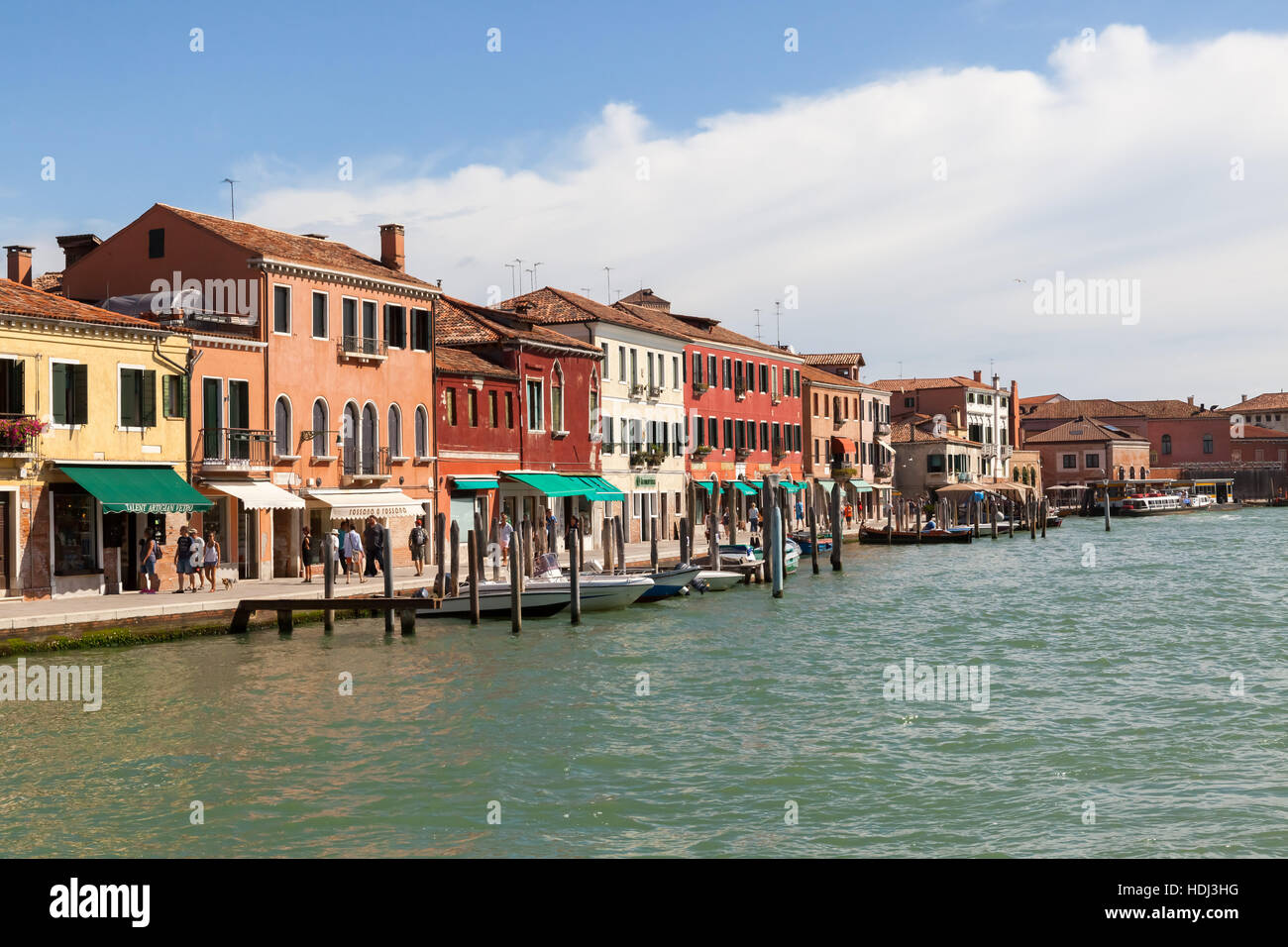 Vibrant building facades along tranquil canals in Murano island Stock ...