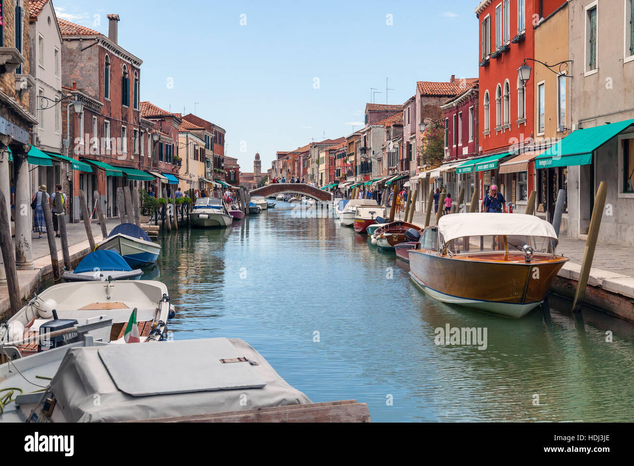 Vibrant building facades along tranquil canals in Murano island Stock ...