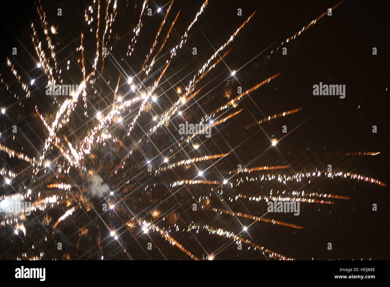 Fireworks light explosion in dark sky Stock Photo - Alamy