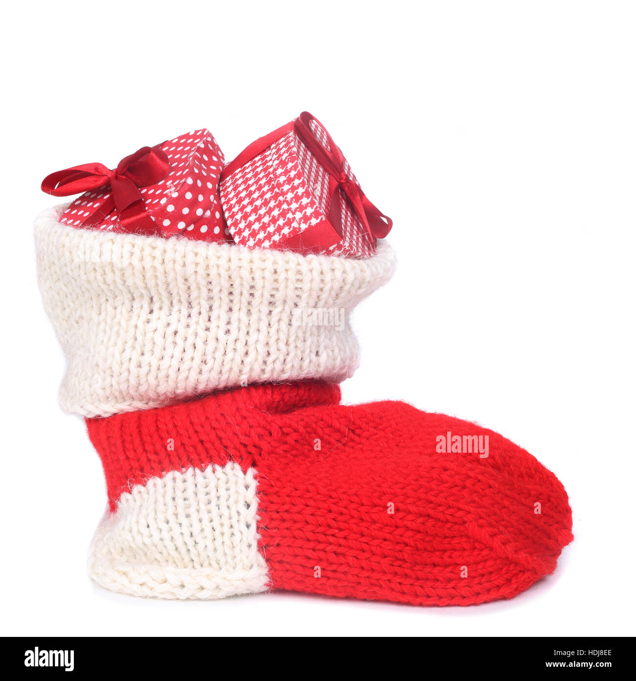 Red Christmas sock with gifts isolated on white background Stock Photo ...